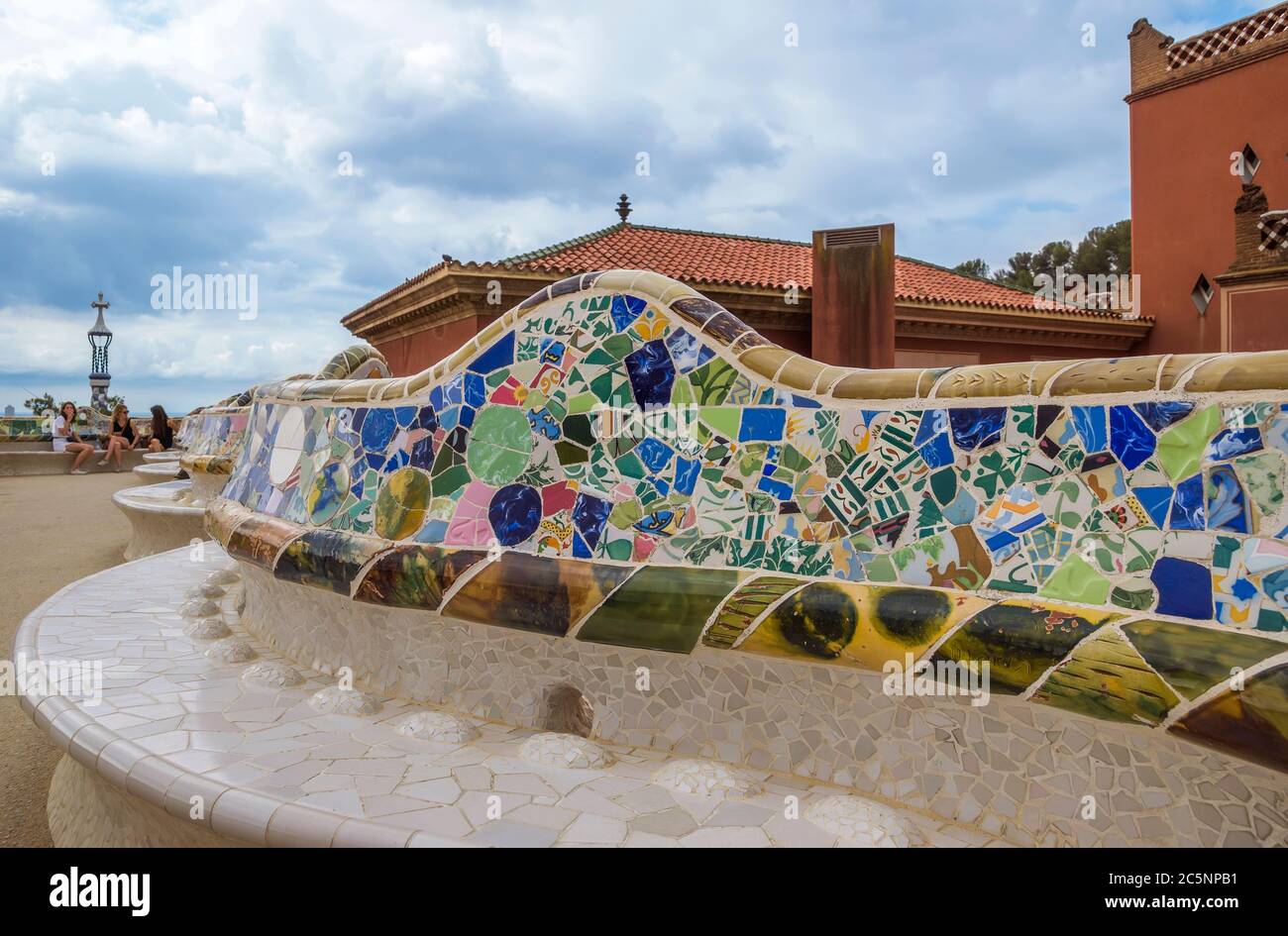 BARCELONA, SPAIN - JULY 3, 2016: Colorful ceramic bench in Park Guell ...