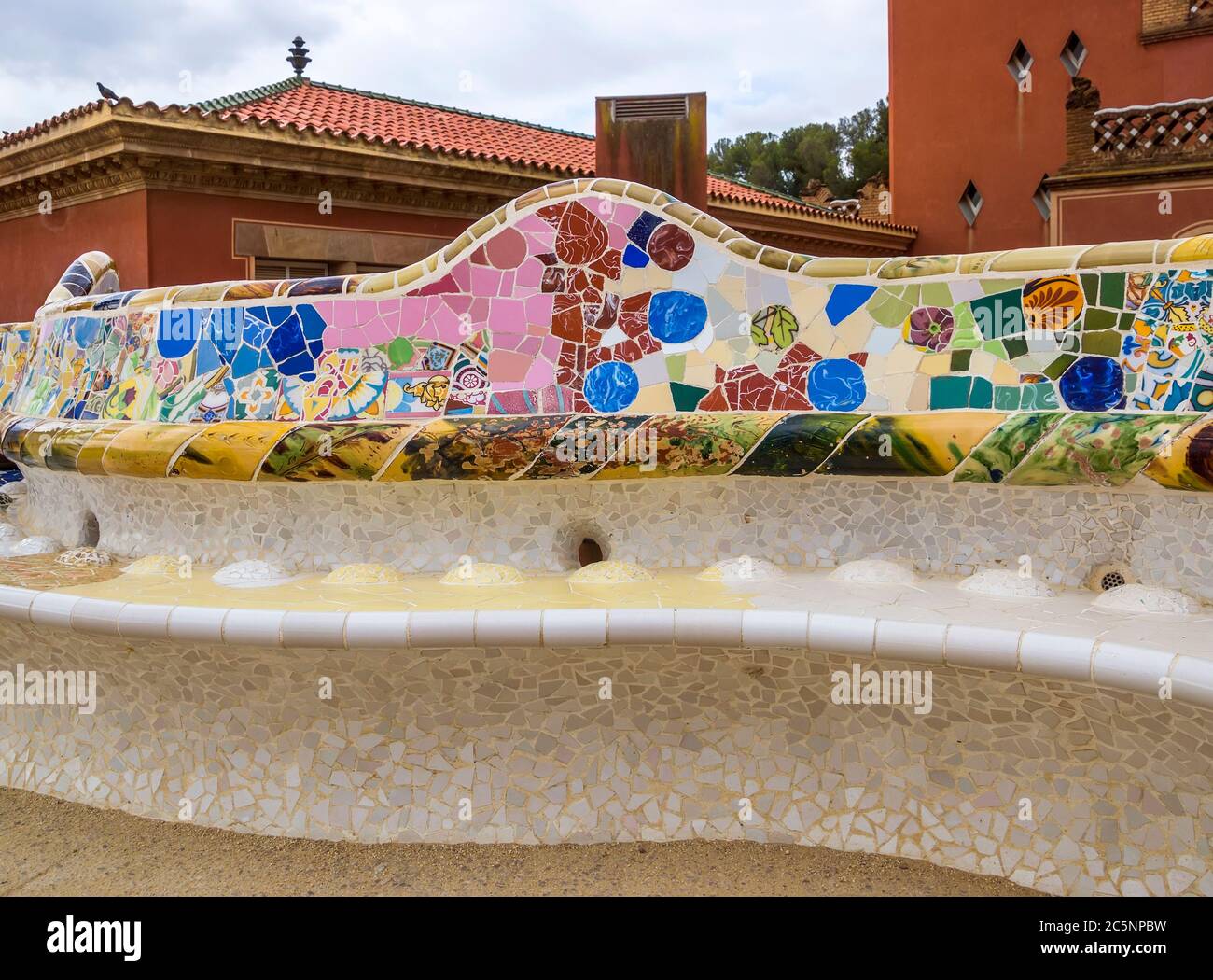 BARCELONA, SPAIN - JULY 3, 2016: Colorful ceramic bench in Park Guell ...