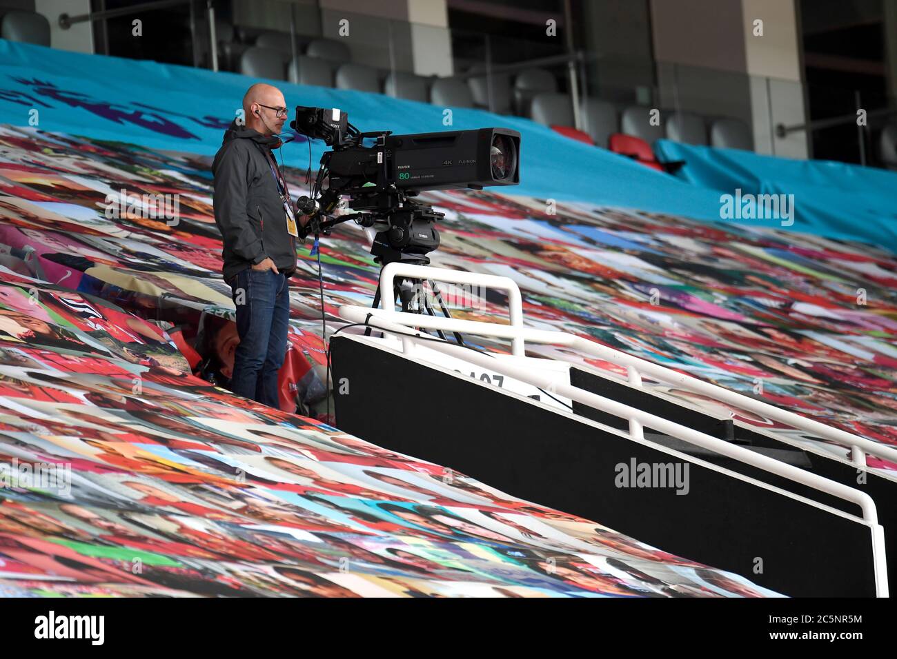 TV camera operator in the stands during the Premier League match at Old ...
