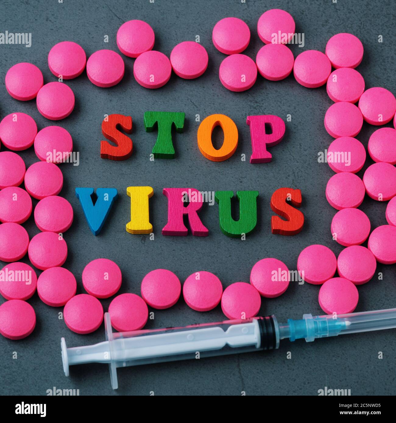 The stop sign consists of multicolored letters in a frame of bright ...