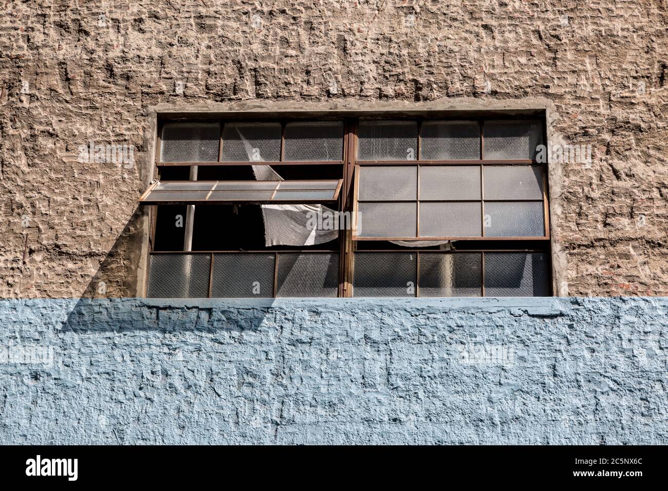 A painted exterior of a building, and an open window Stock Photo - Alamy