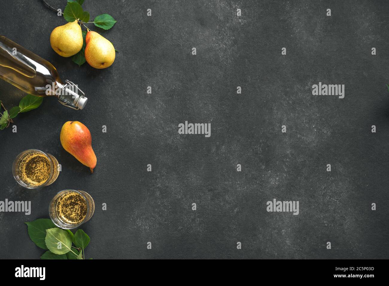 Pear cider drink or fermented fruit drink in glasses and bottle and ...