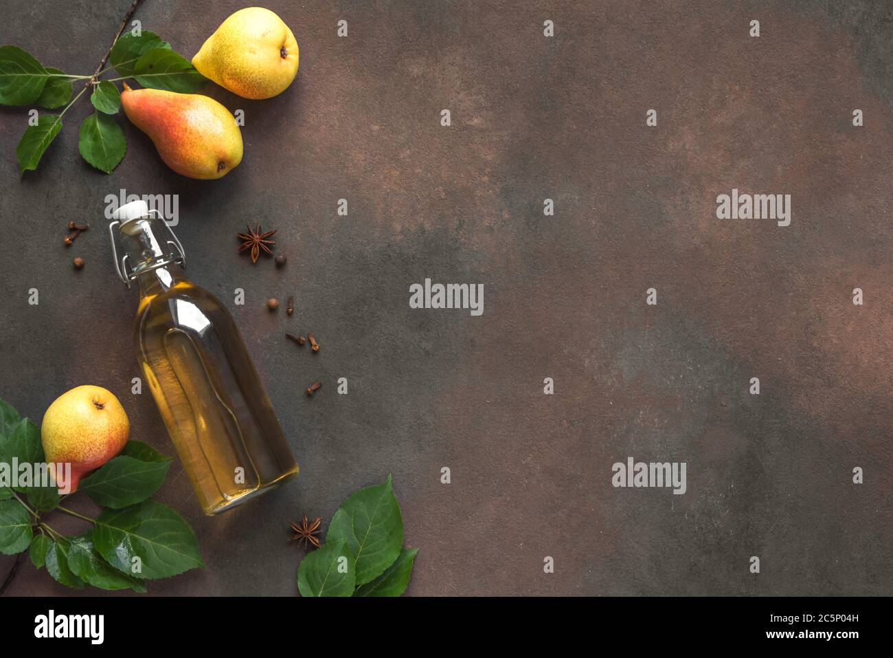 Pear cider drink or fermented fruit drink in glasses and bottle and ...