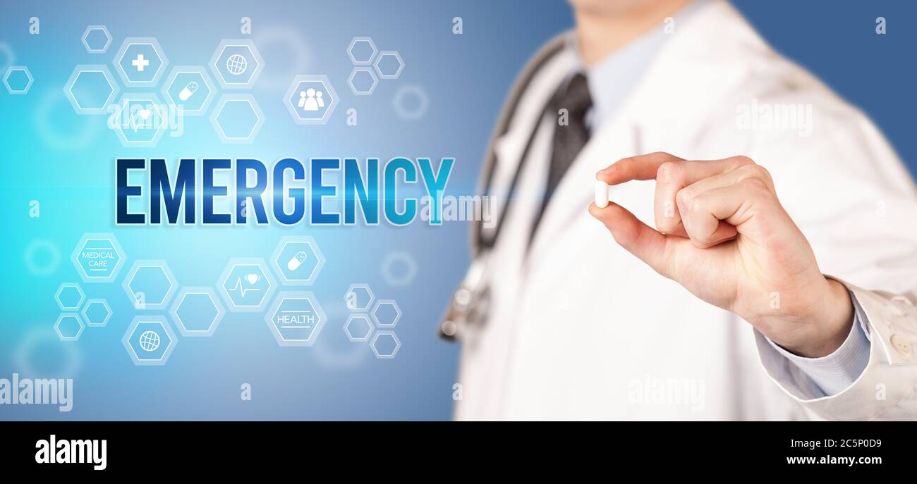 Close-up of a doctor giving you a pill with EMERGENCY inscription ...