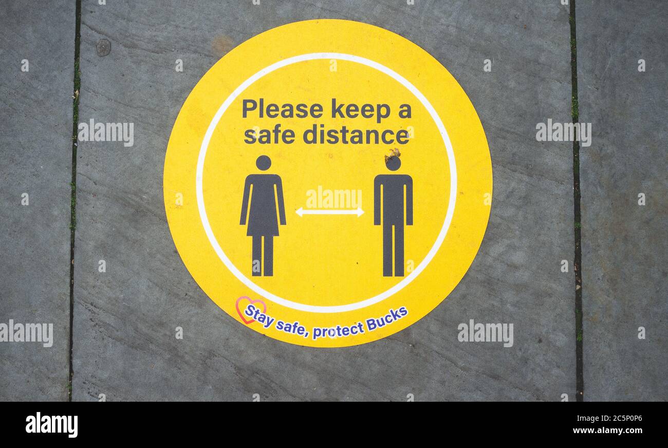 'Please keep a safe distance'. Signs on walkways in Buckingham town ...