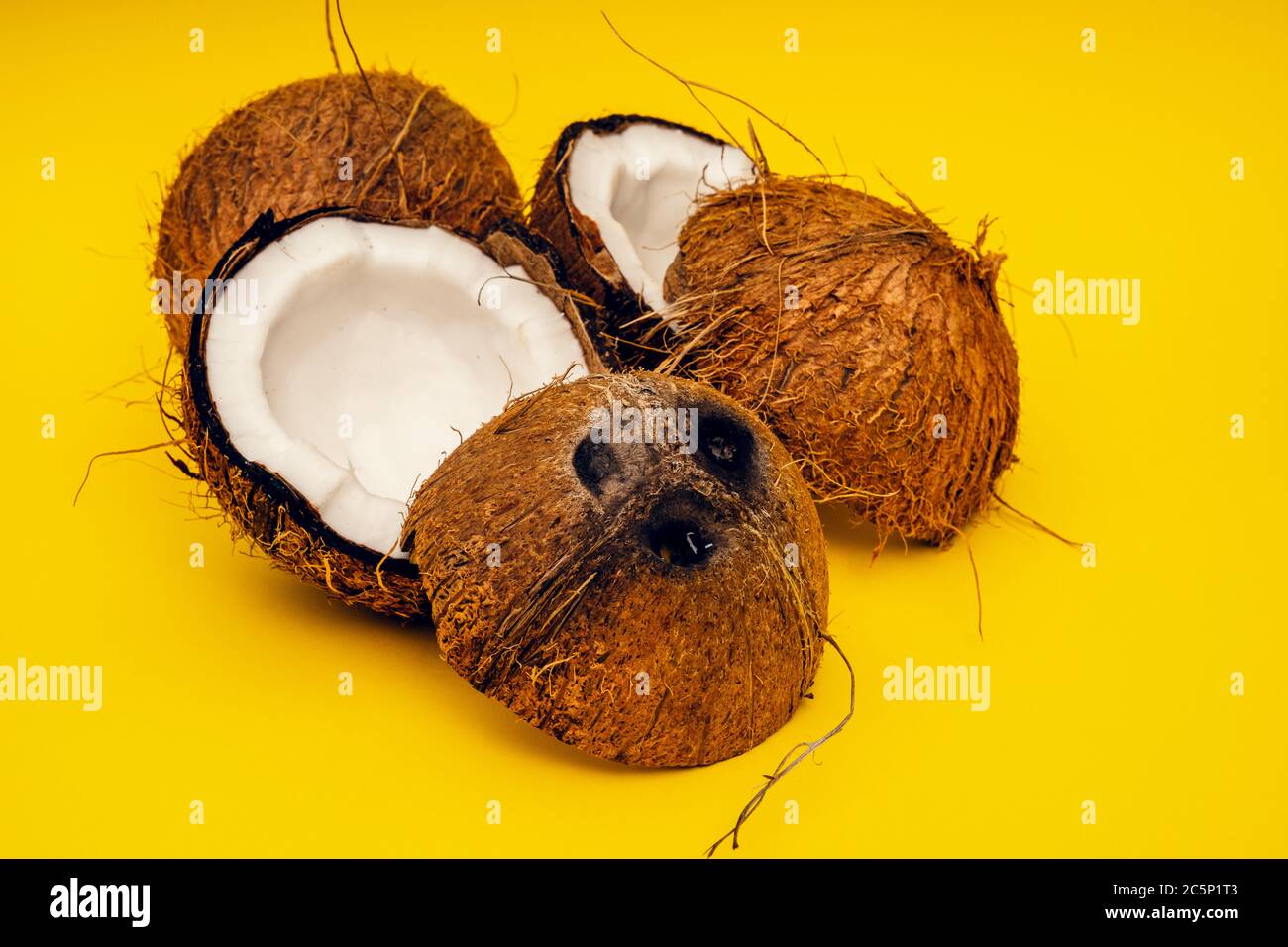 Parts of coconut on a colored background. Close up. Fresh ripe coconut ...