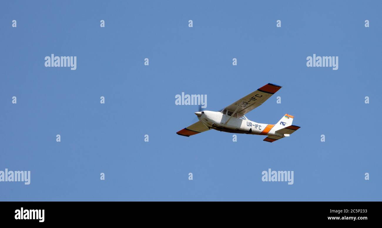 Kyiv, Ukraine - May 12, 2020: A small plane flies in the blue sky ...