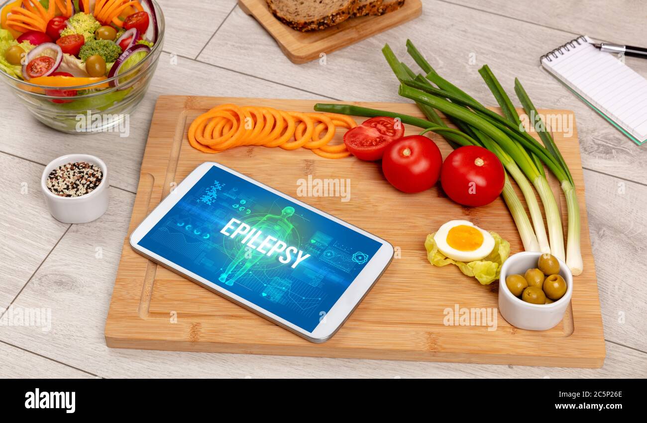 EPILEPSY concept in tablet with fruits, top view Stock Photo - Alamy