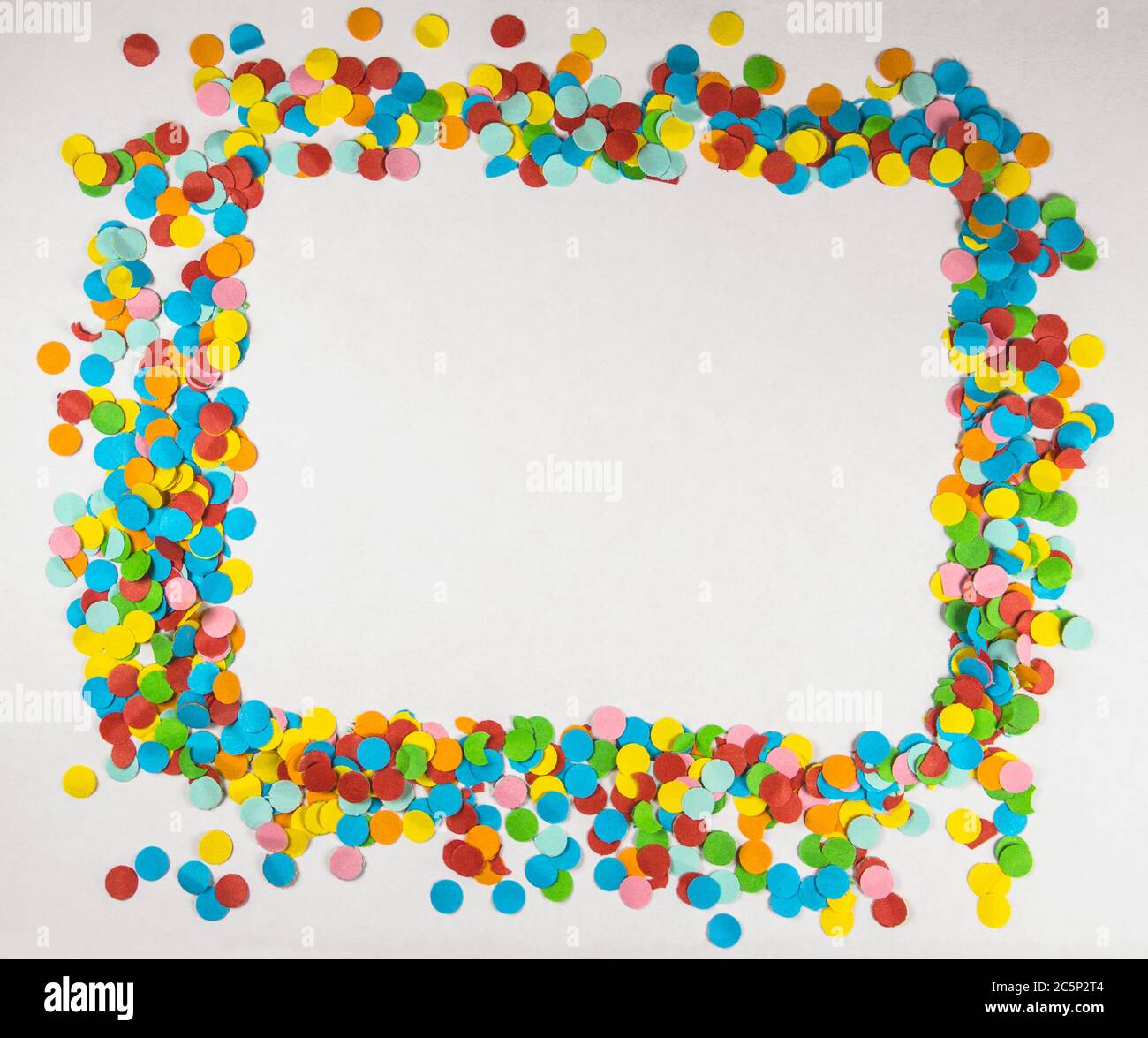 Festive paper circular colorful confetti frame closeup Stock Photo - Alamy