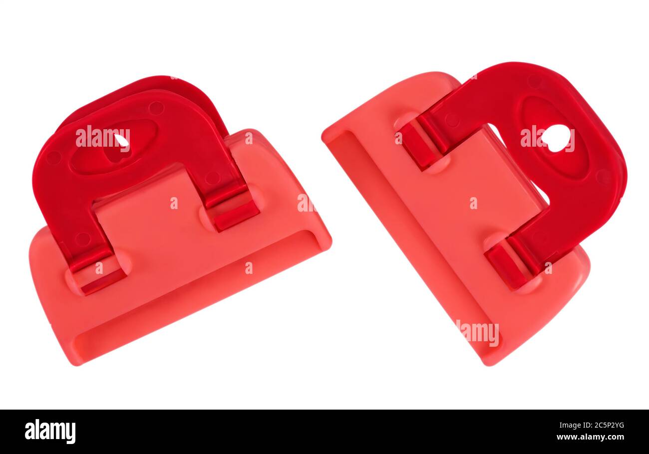 Red plastic clamps isolated on white background. Clipping path included ...