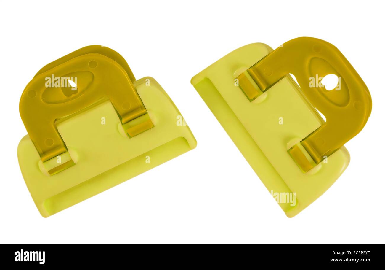 Yellow plastic clamps isolated on white background. Clipping path ...