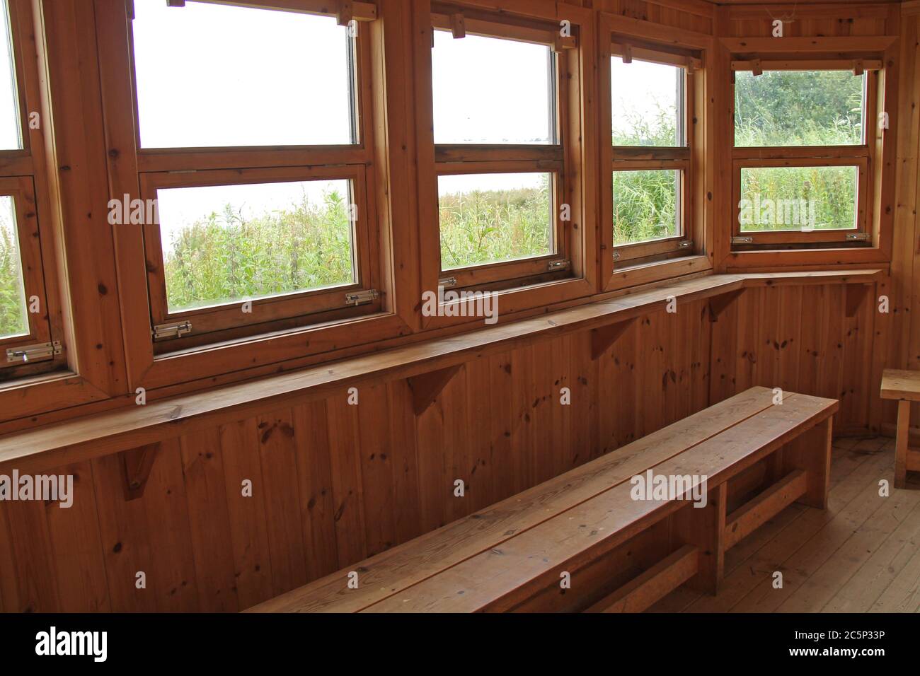 The Inside of a Wooden Lakeside Bird Watching Hide Stock Photo - Alamy