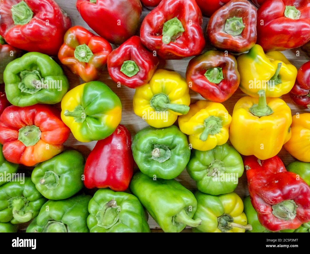 Colorful bell peppers natural background Stock Photo - Alamy