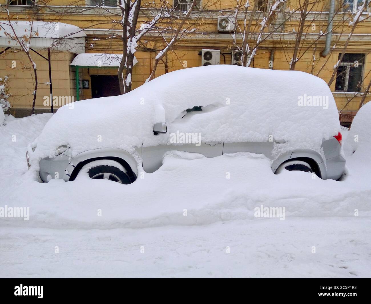 Car under the snow. Roads are blocked Stock Photo - Alamy