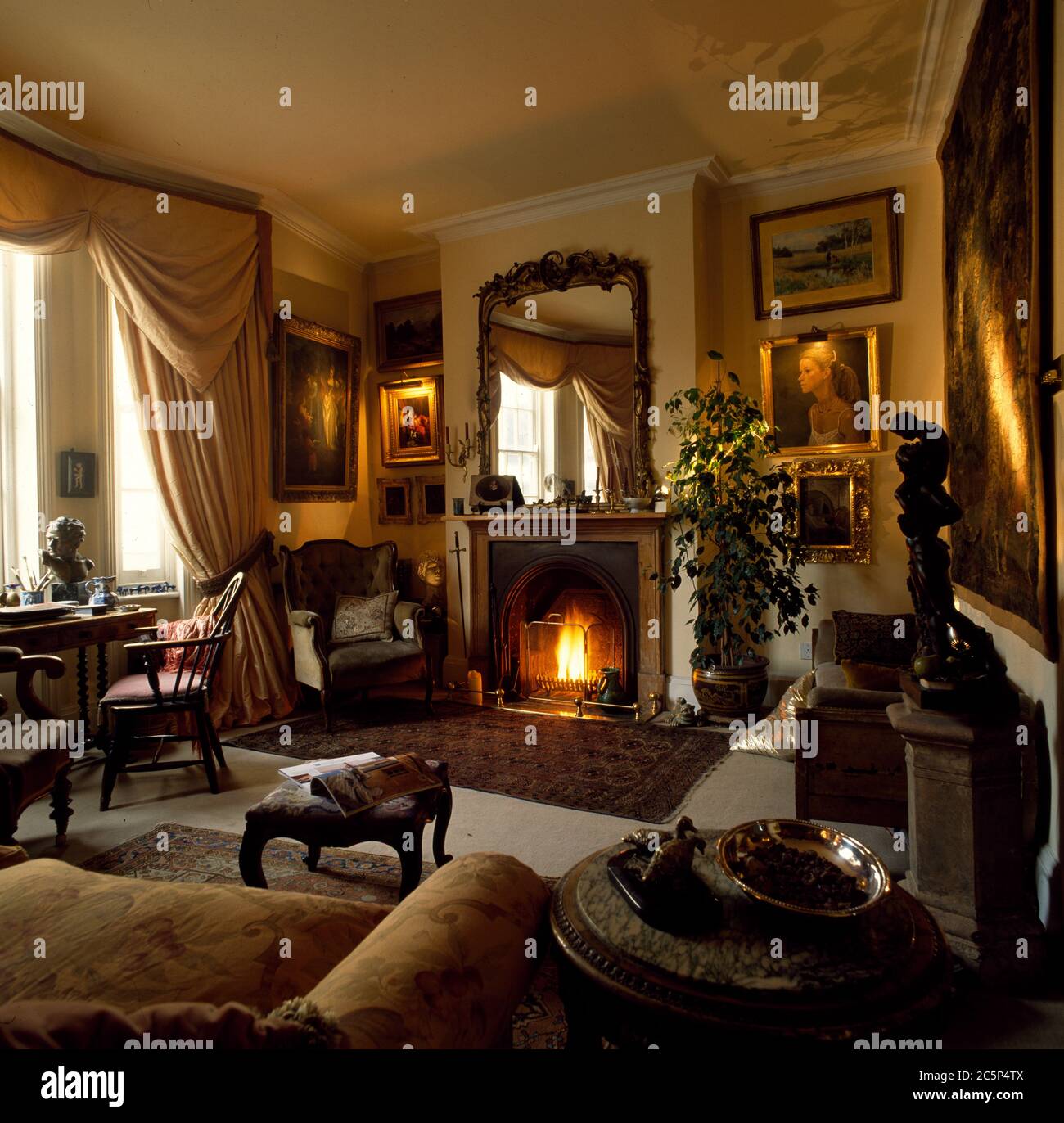 Traditional livingroom with open fire Stock Photo - Alamy