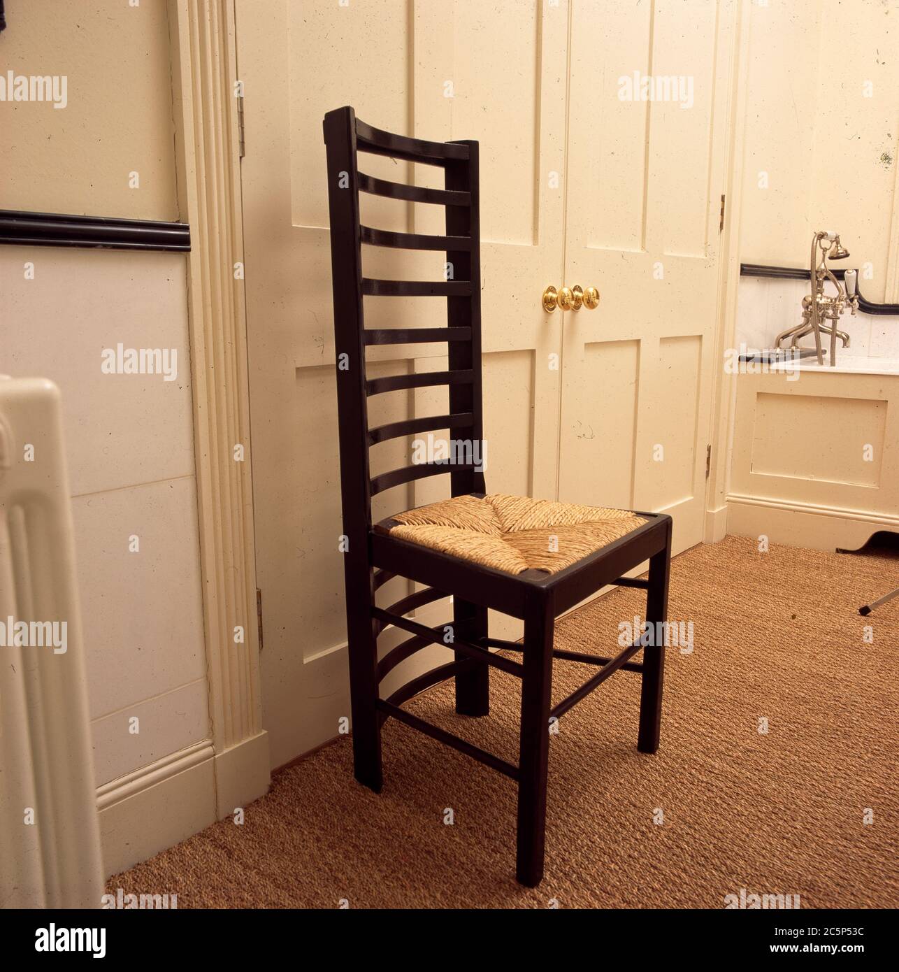 Mackintosh style chair in bathroom Stock Photo - Alamy