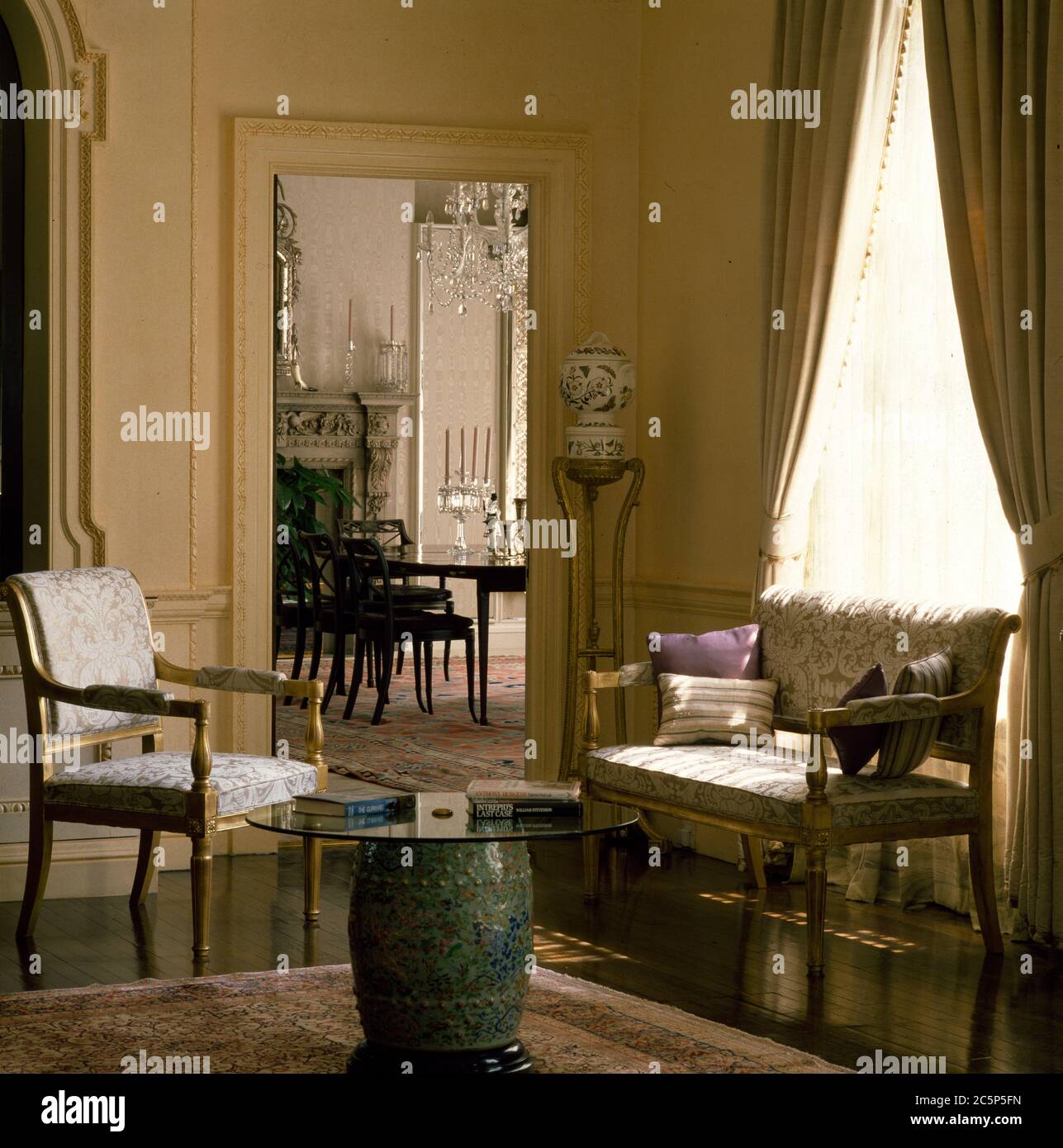 Traditional anti room to diningroom in grand home Stock Photo - Alamy