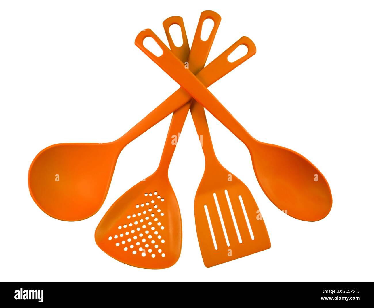Orange plastic kitchen utensils isolated on white. Clipping path ...