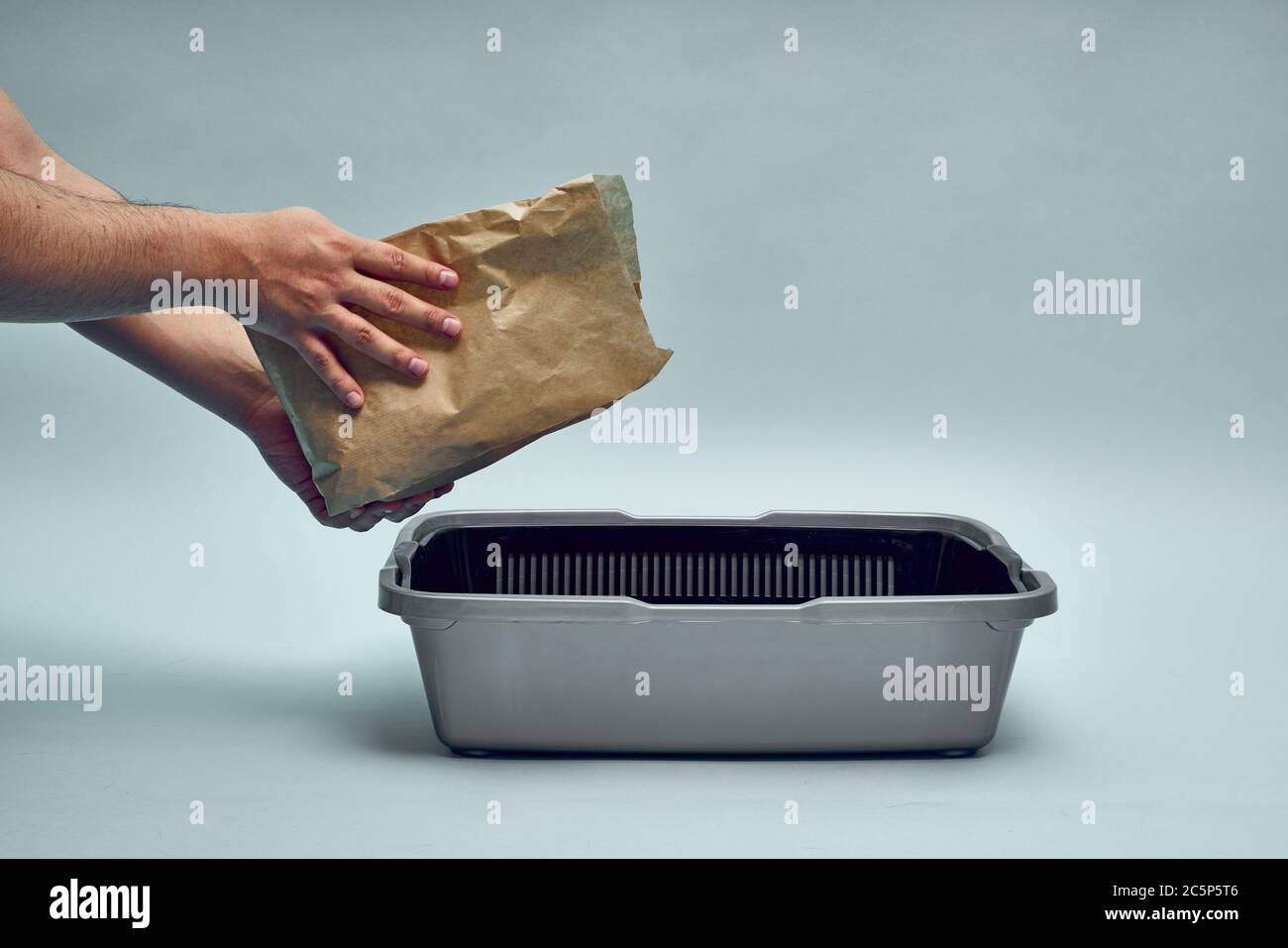 New gray, empty cat tray. Tray filler, biodegradable cat litter. Toilet ...