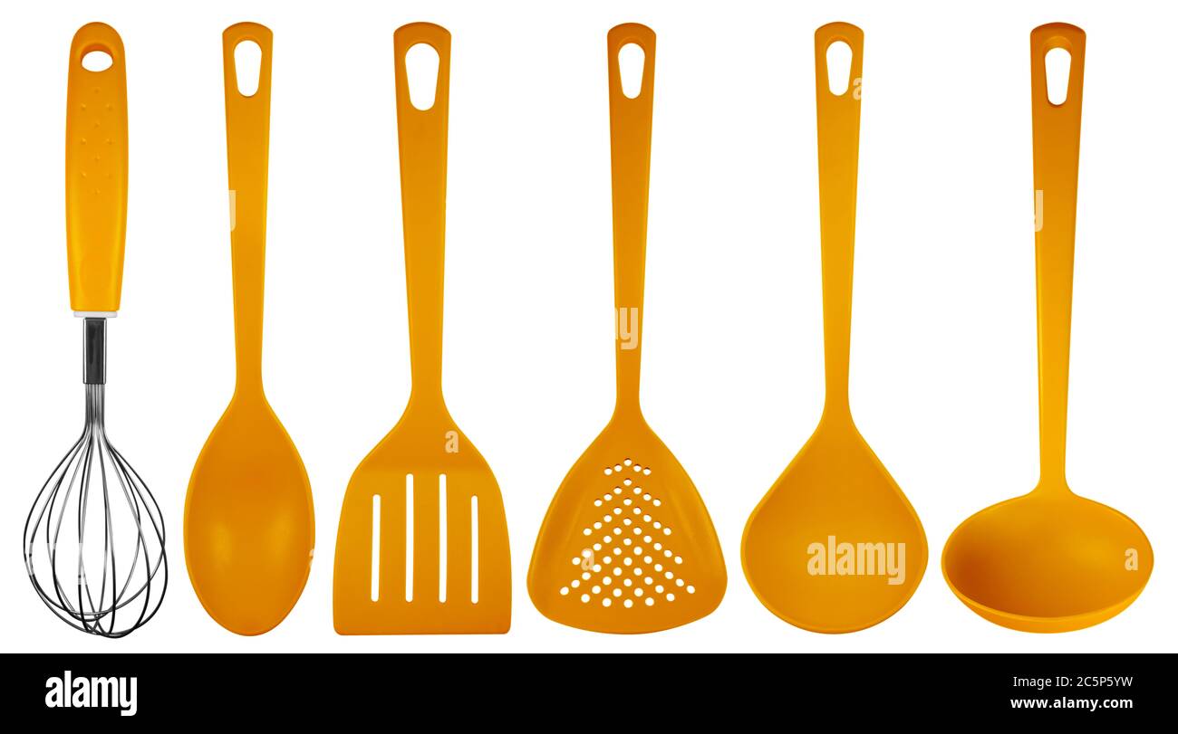 Orange plastic kitchen utensils isolated on white. Clipping path ...