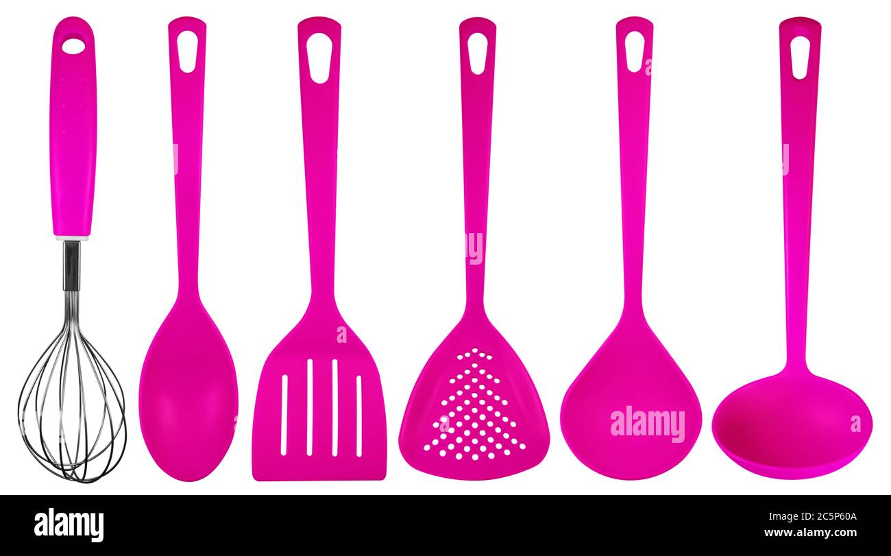 Pink plastic kitchen utensils isolated on white. Clipping path included ...