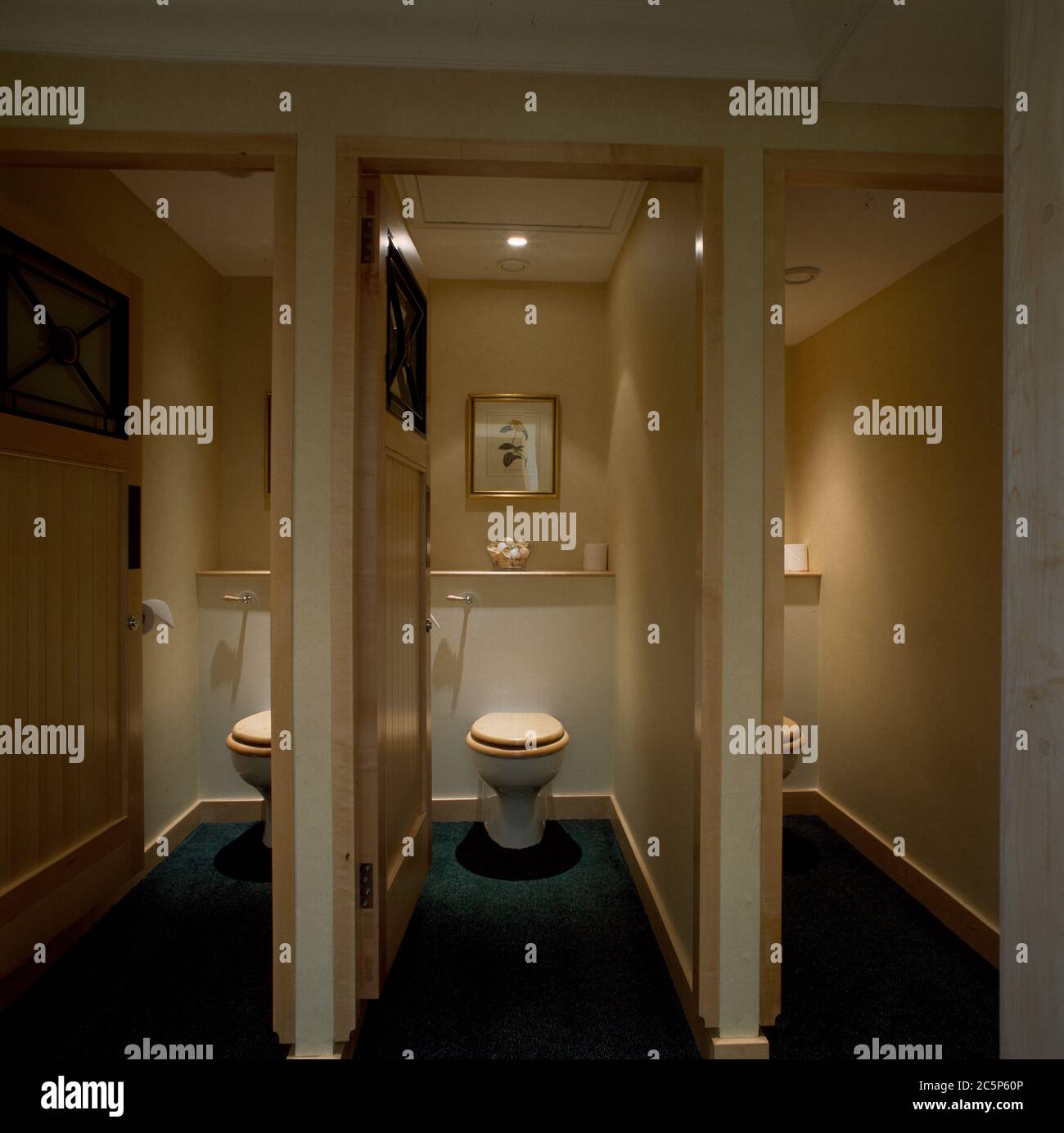 Three toilets in hotel clockroom Stock Photo - Alamy
