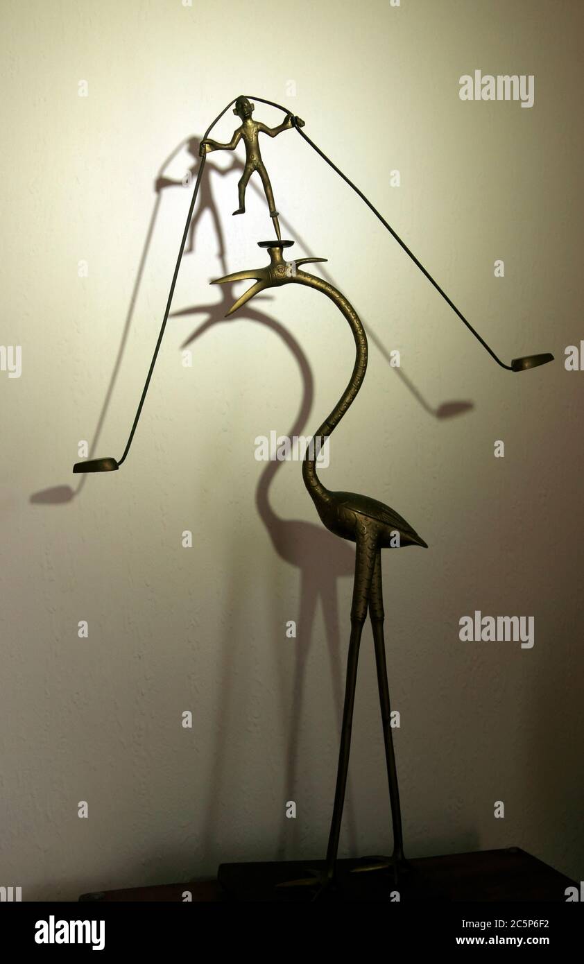 Metal sculpture of a balancing figure Stock Photo - Alamy