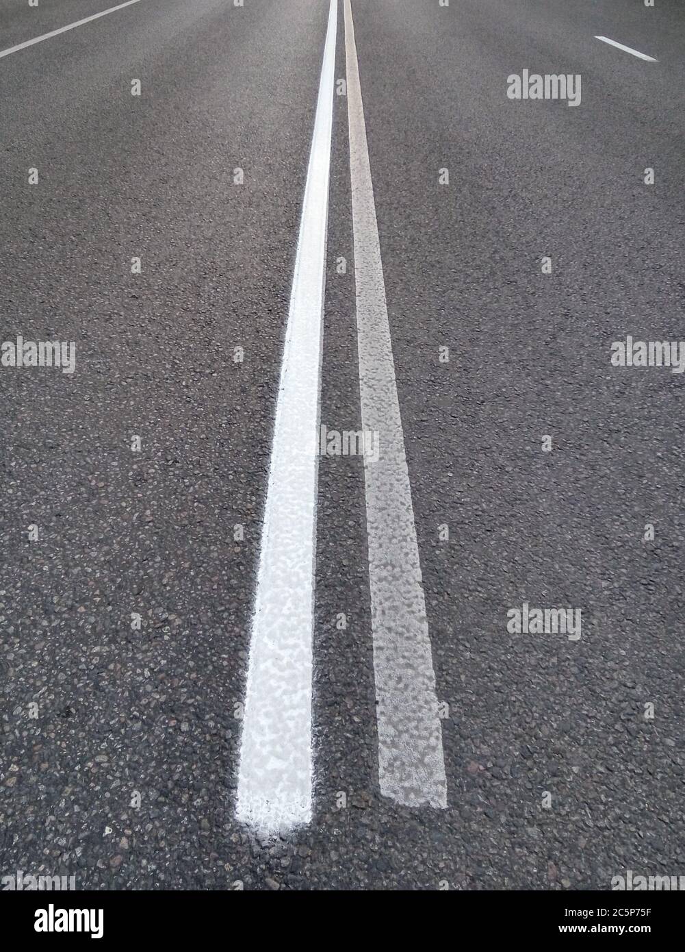 Markings on the road - The double solid line Stock Photo - Alamy
