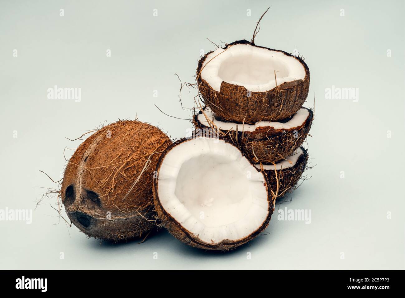 Parts of coconut on a colored background. Close up. Fresh ripe coconut ...