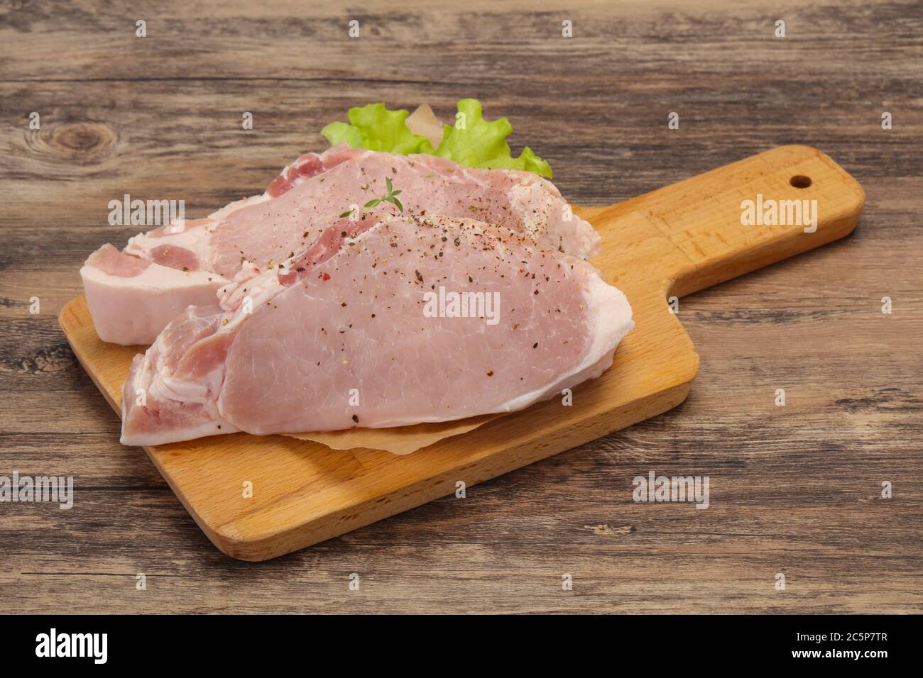 Raw pork meat steak ready for grill Stock Photo - Alamy