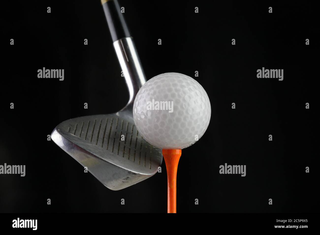 Close-up of golf club making impact with the ball Stock Photo - Alamy