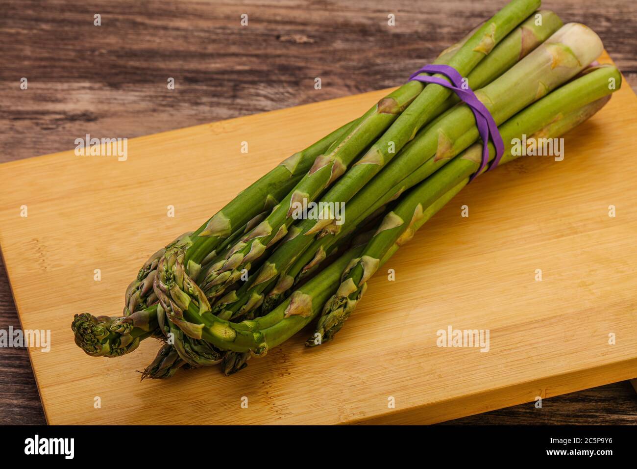 Vegan cuisine - Raw asparagus heap for cooking Stock Photo - Alamy