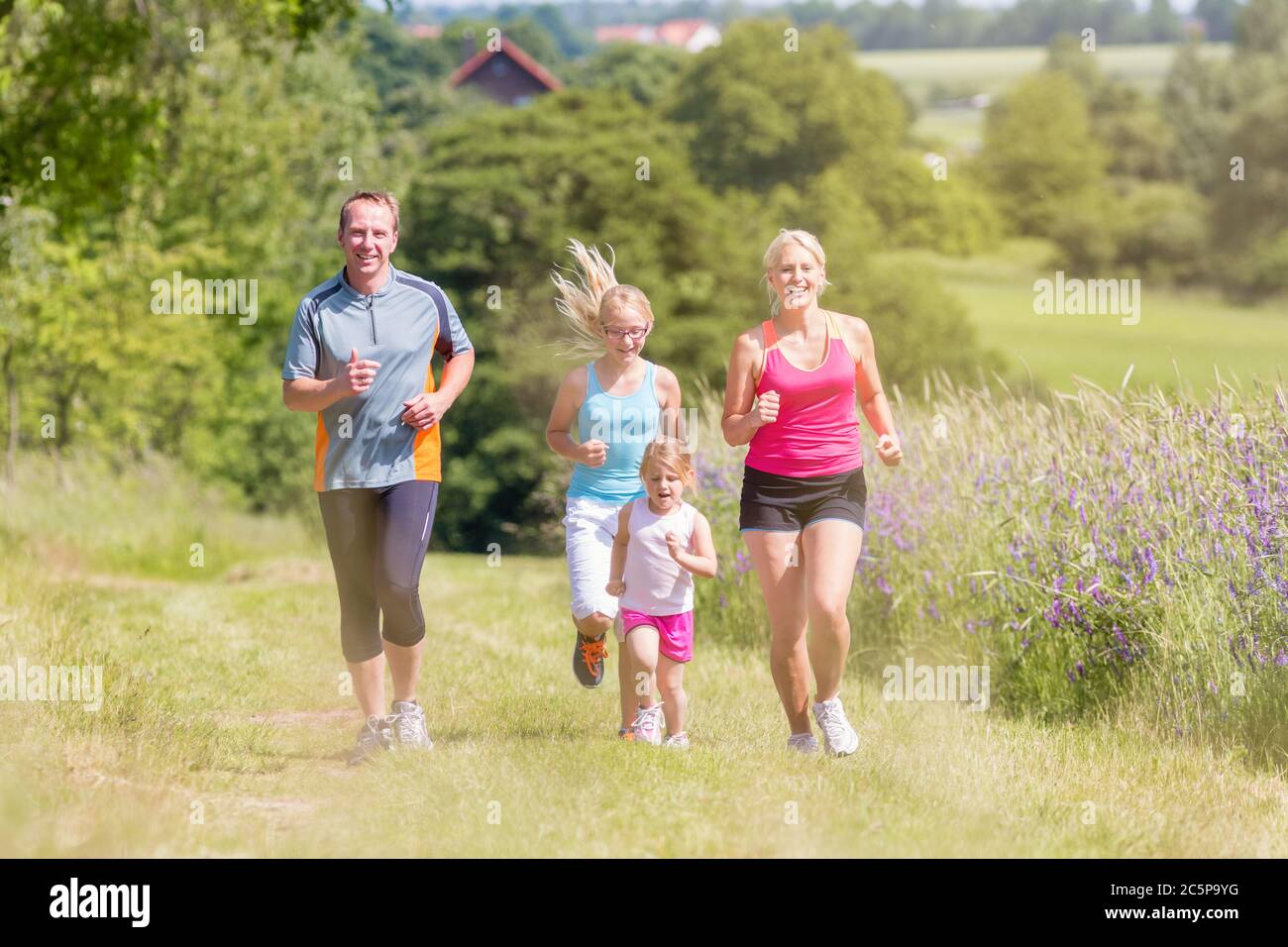 Woman running through field hi-res stock photography and images - Alamy