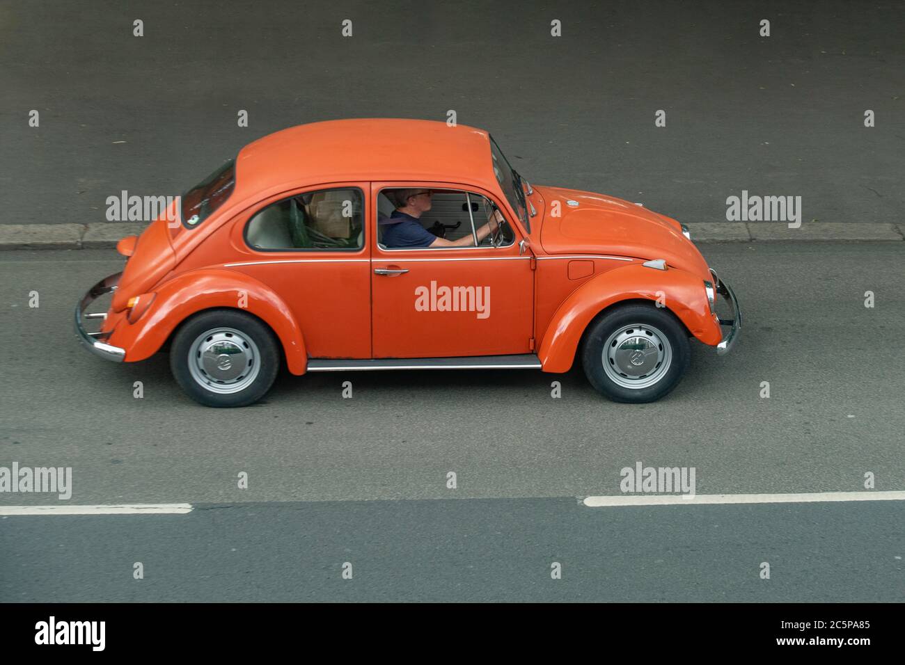 An orange Beetle car Stock Photo - Alamy