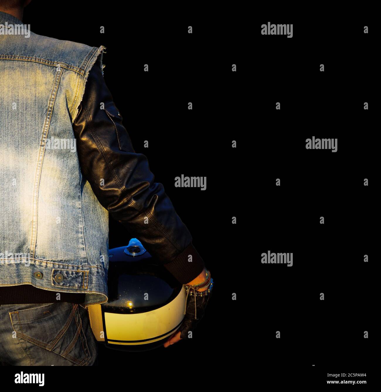 back view of a biker with helmet isolated on black background Stock ...