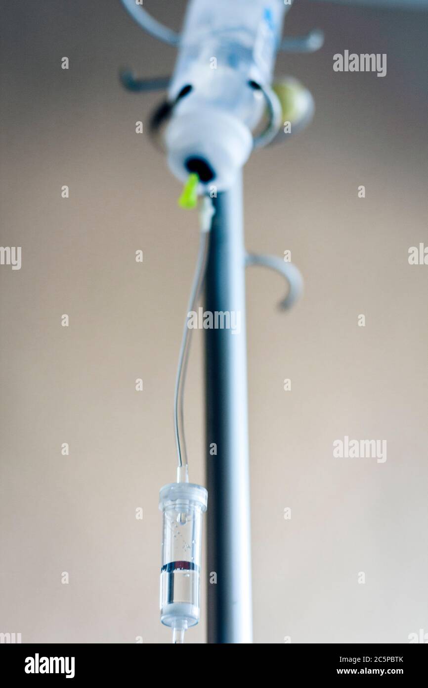 Close-up bottle of medicine on dropper system in the operating room ...