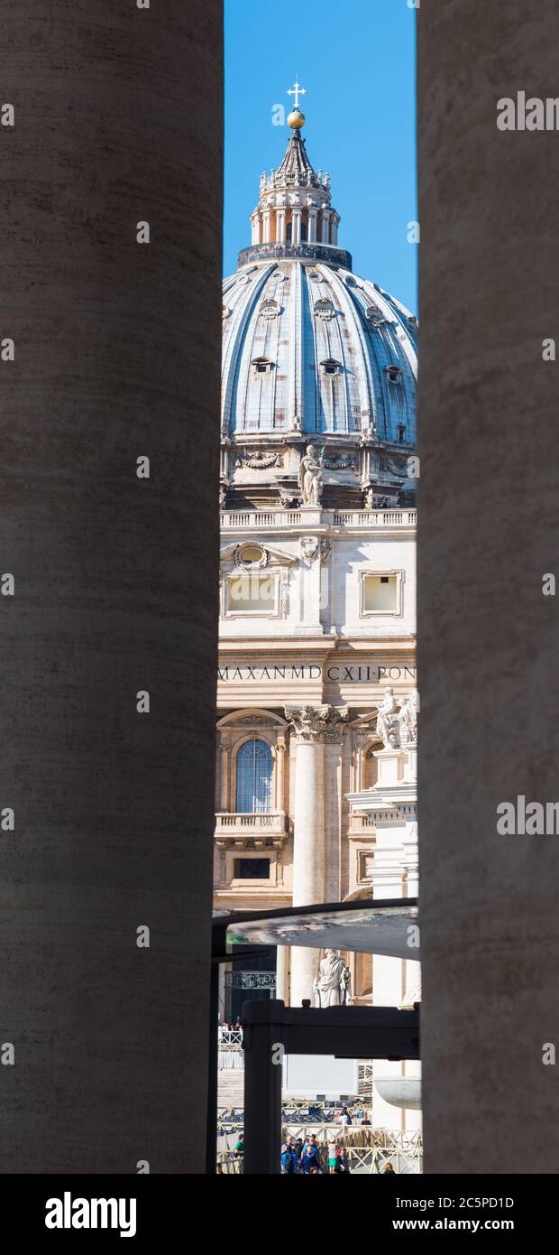 World famous Saint Peters dome seen through columns. Vatican City Stock ...