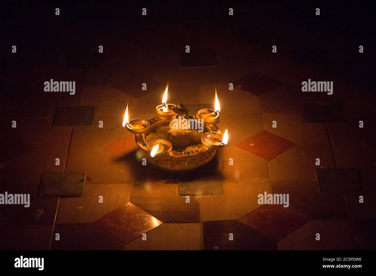 Lamp light flames at night - close up shot Stock Photo - Alamy