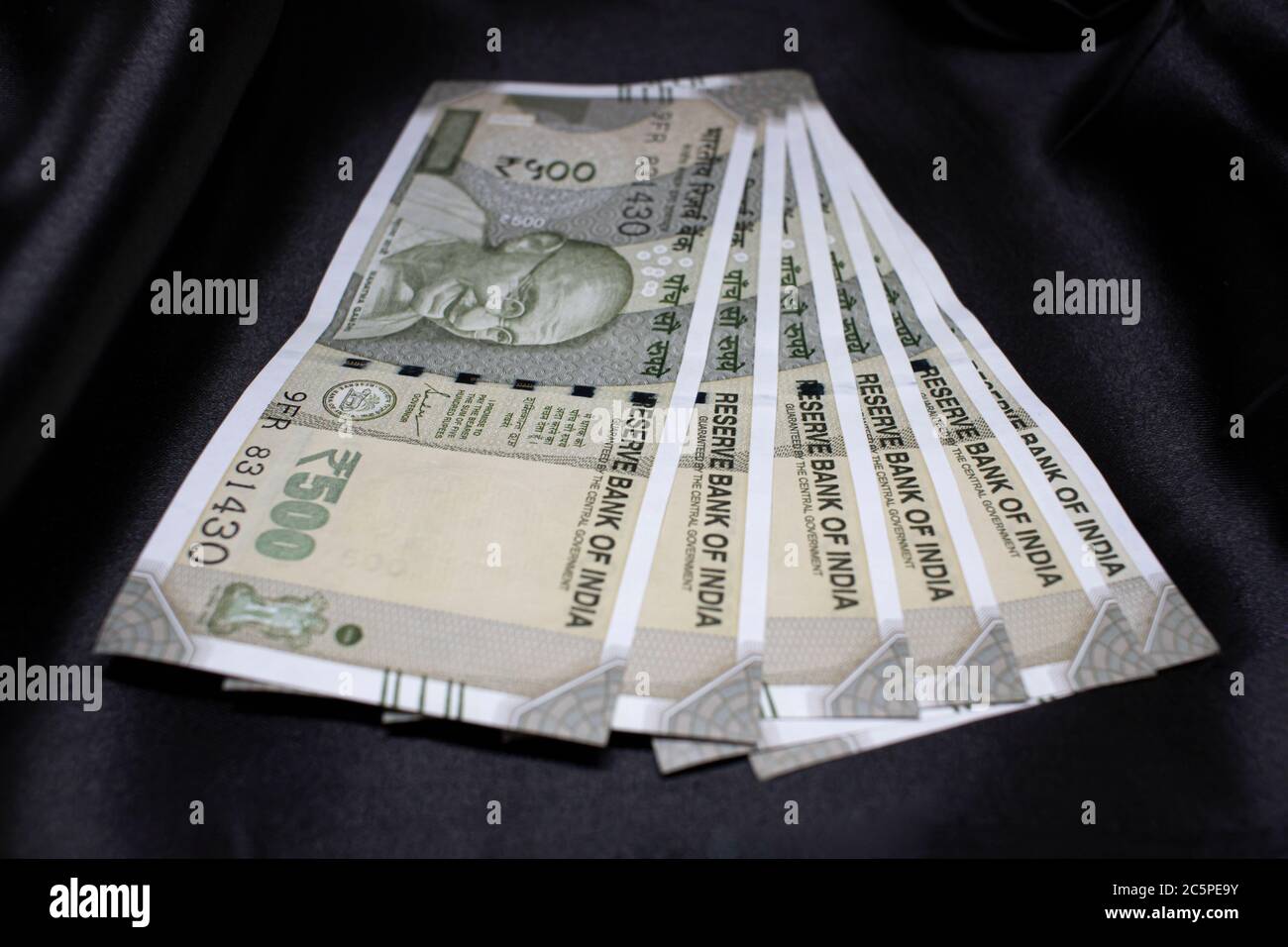 Indian 500 Rupees notes on black background Stock Photo - Alamy