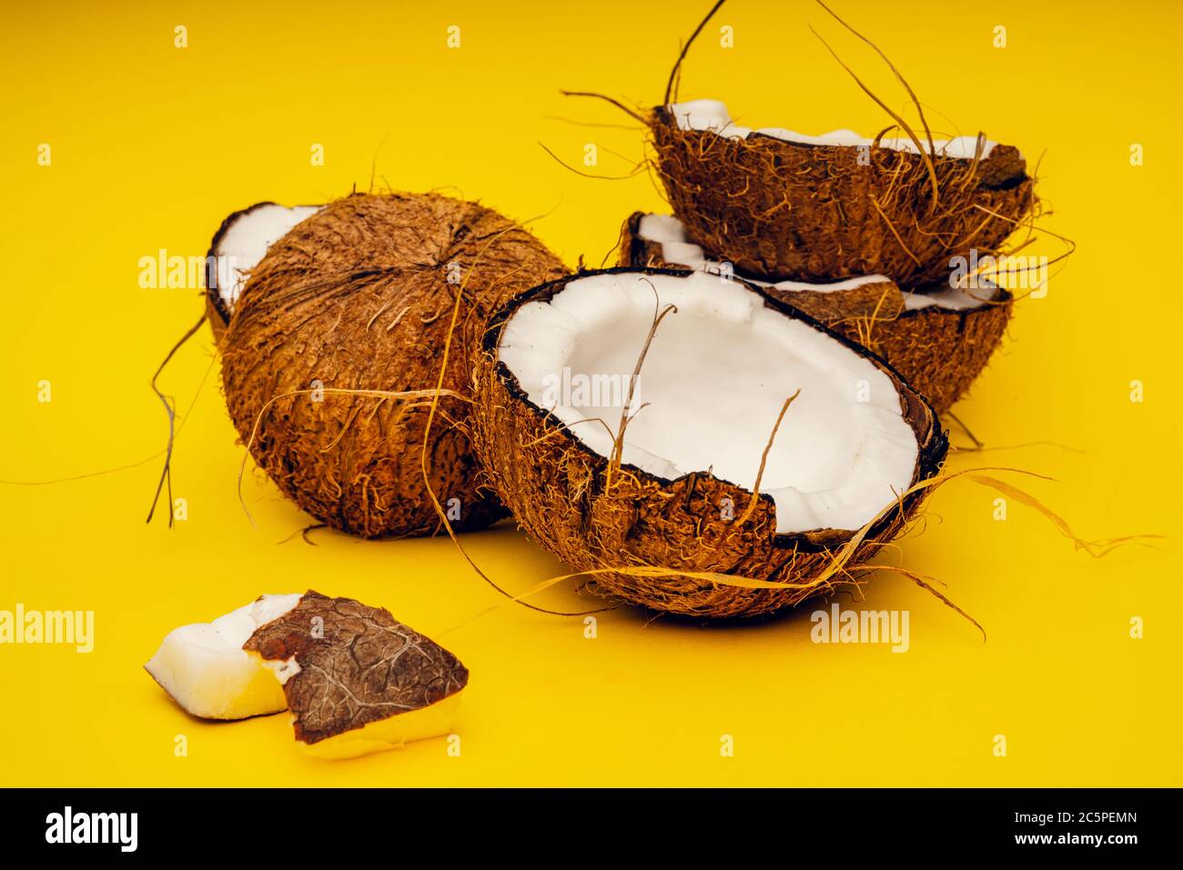 Parts of coconut on a colored background. Close up. Fresh ripe coconut ...