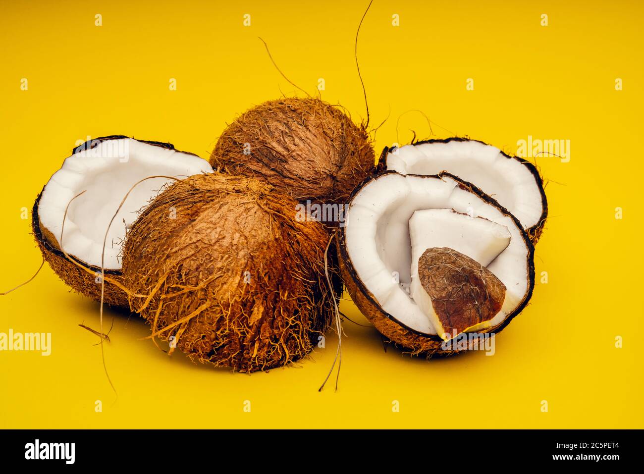 Parts of coconut on a colored background. Close up. Fresh ripe coconut ...