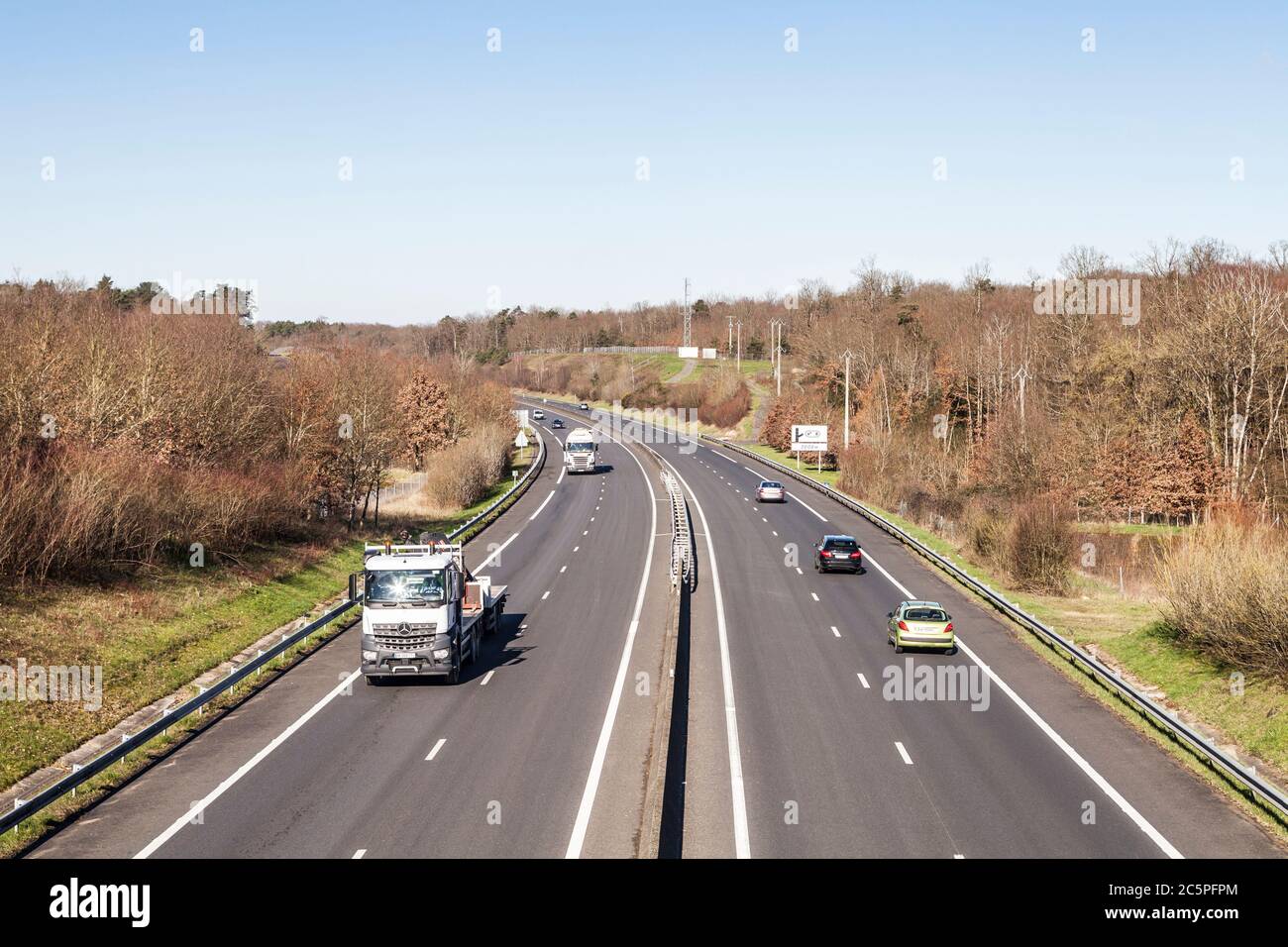 Trucks and traffic on a busy highway Stock Photo - Alamy