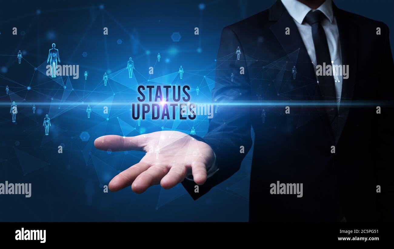 Elegant hand holding STATUS UPDATES inscription, social networking ...