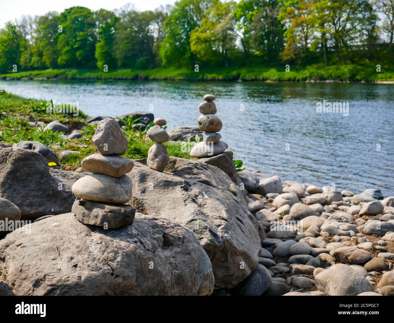 Balanced stone stacks on riverbank, River Tay, Perthshire, Scotland, UK ...