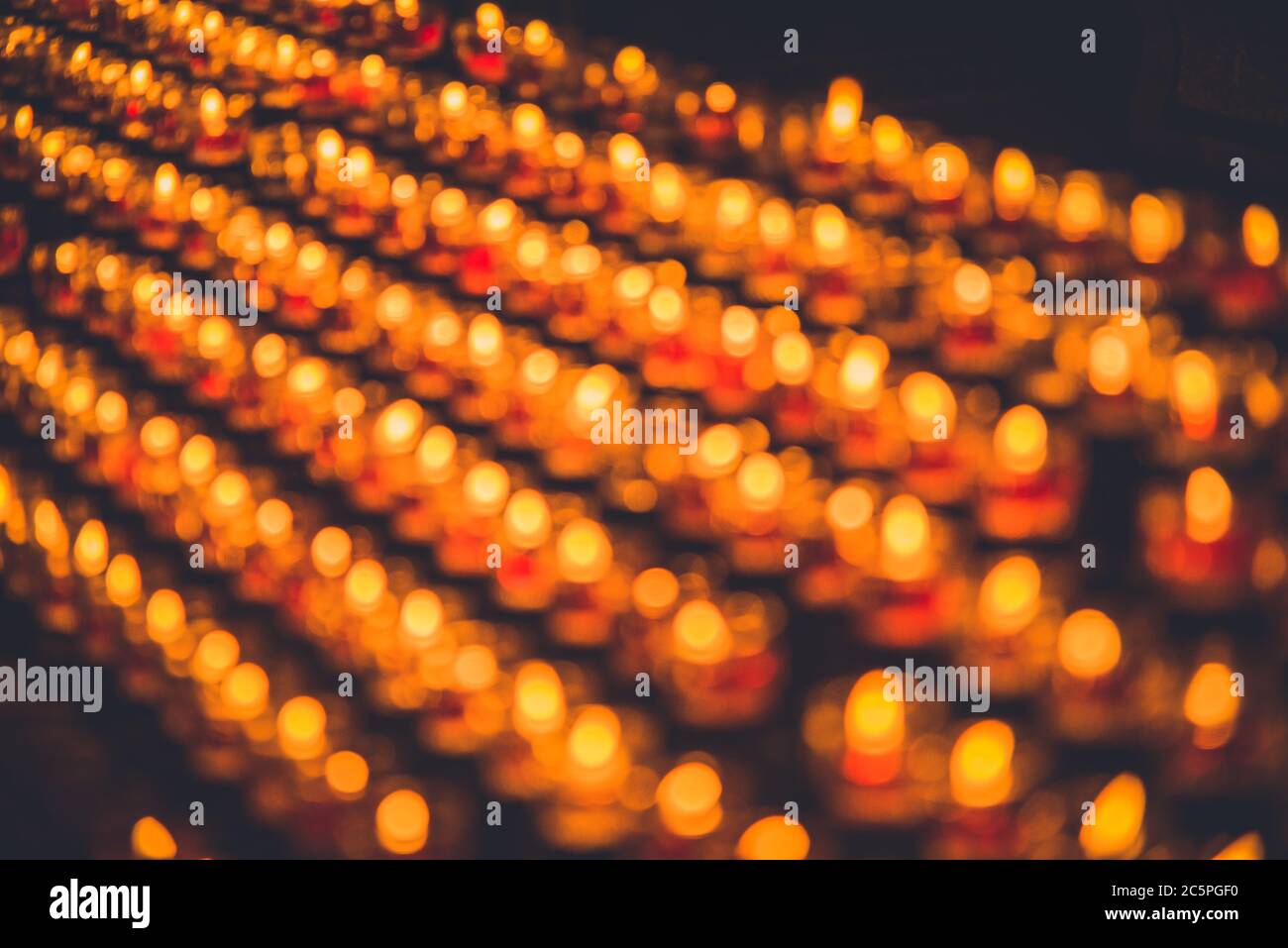 Unfocused shot of hundreds of candles in the church Stock Photo - Alamy