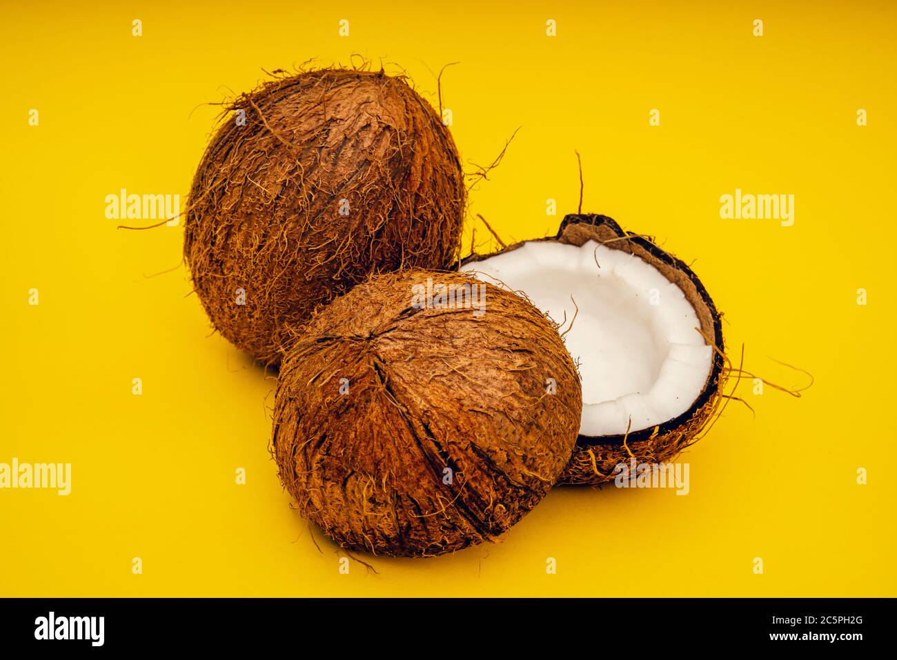 Parts of coconut on a colored background. Close up. Fresh ripe coconut ...