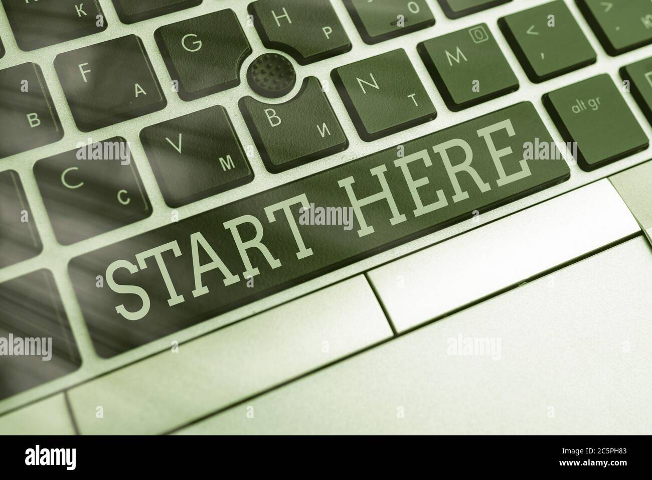 Writing note showing Start Here. Business concept for an act of ...