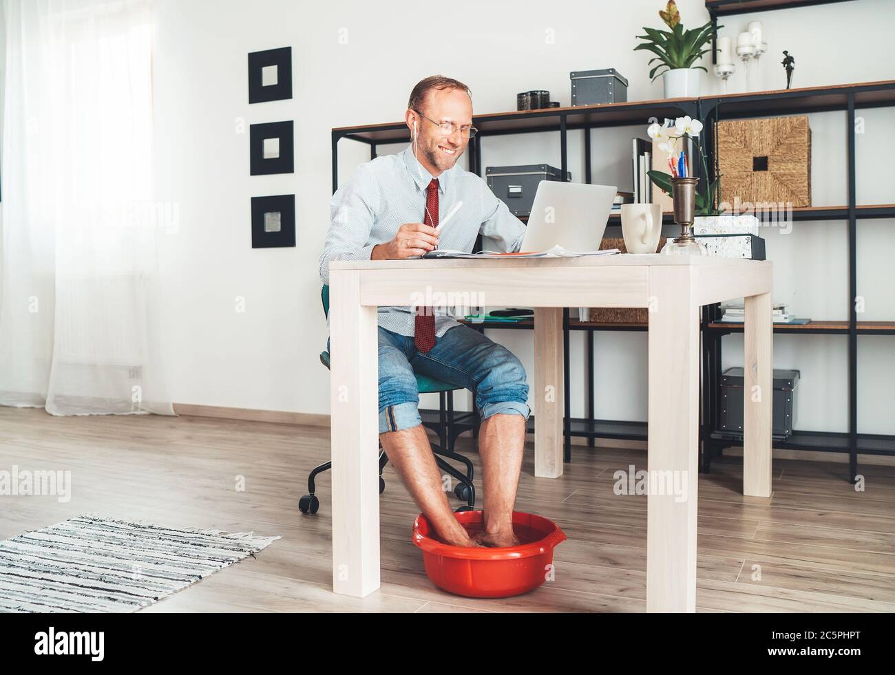 Comic modern office table situation. Businessman typing on laptop ...