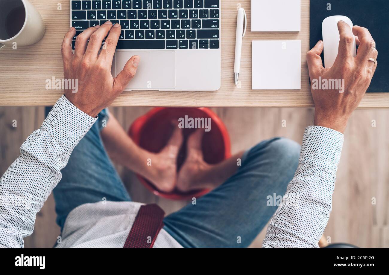 Man barefoot feet table hi-res stock photography and images - Alamy