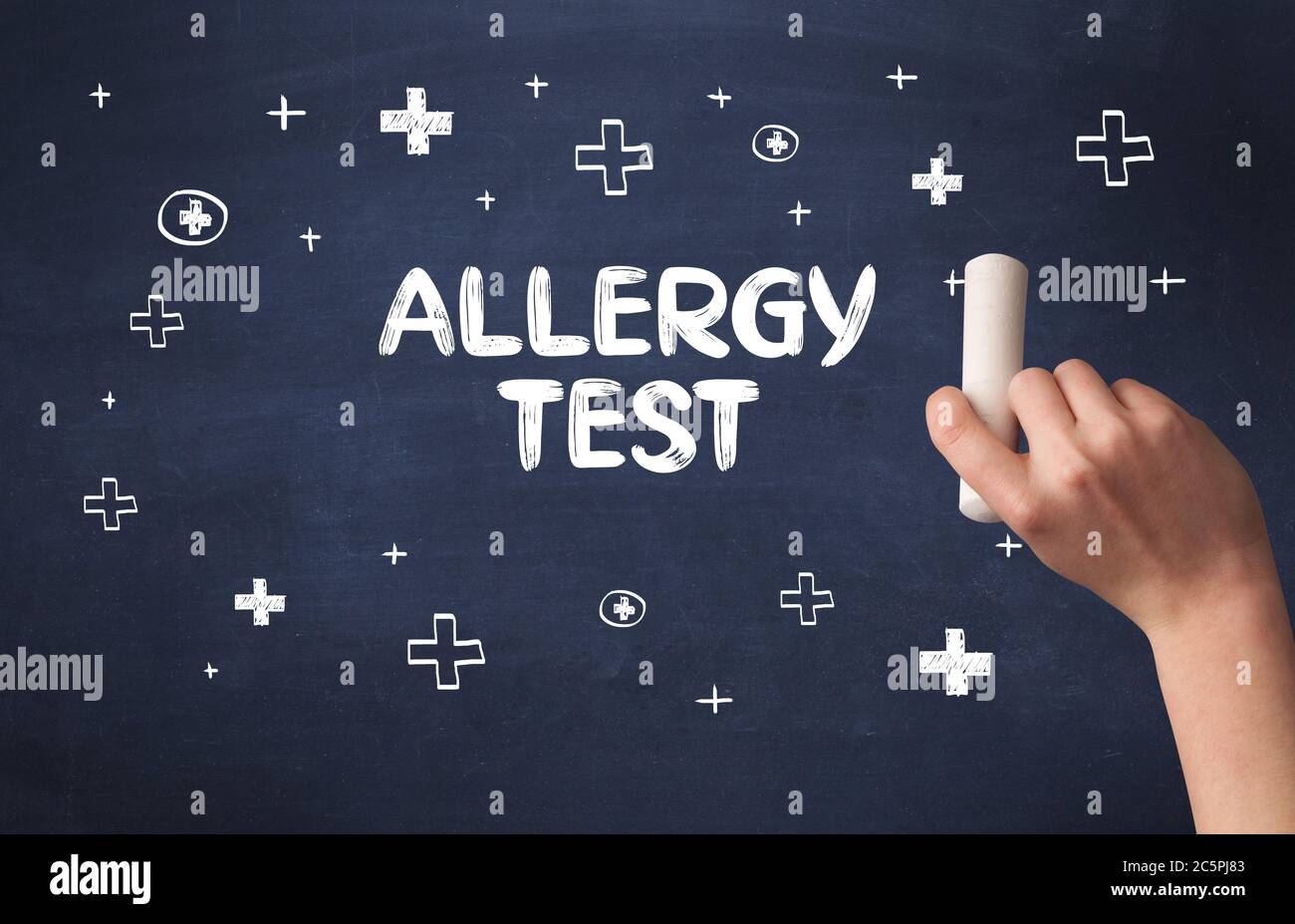 Hand drawing ALLERGY TEST inscription with white chalk on blackboard ...